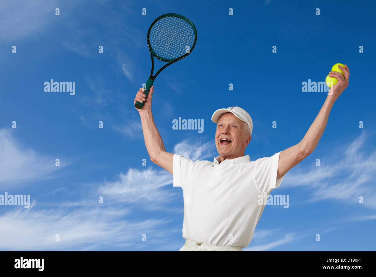 Senior male tennis player cheering Stock Photo - Alamy