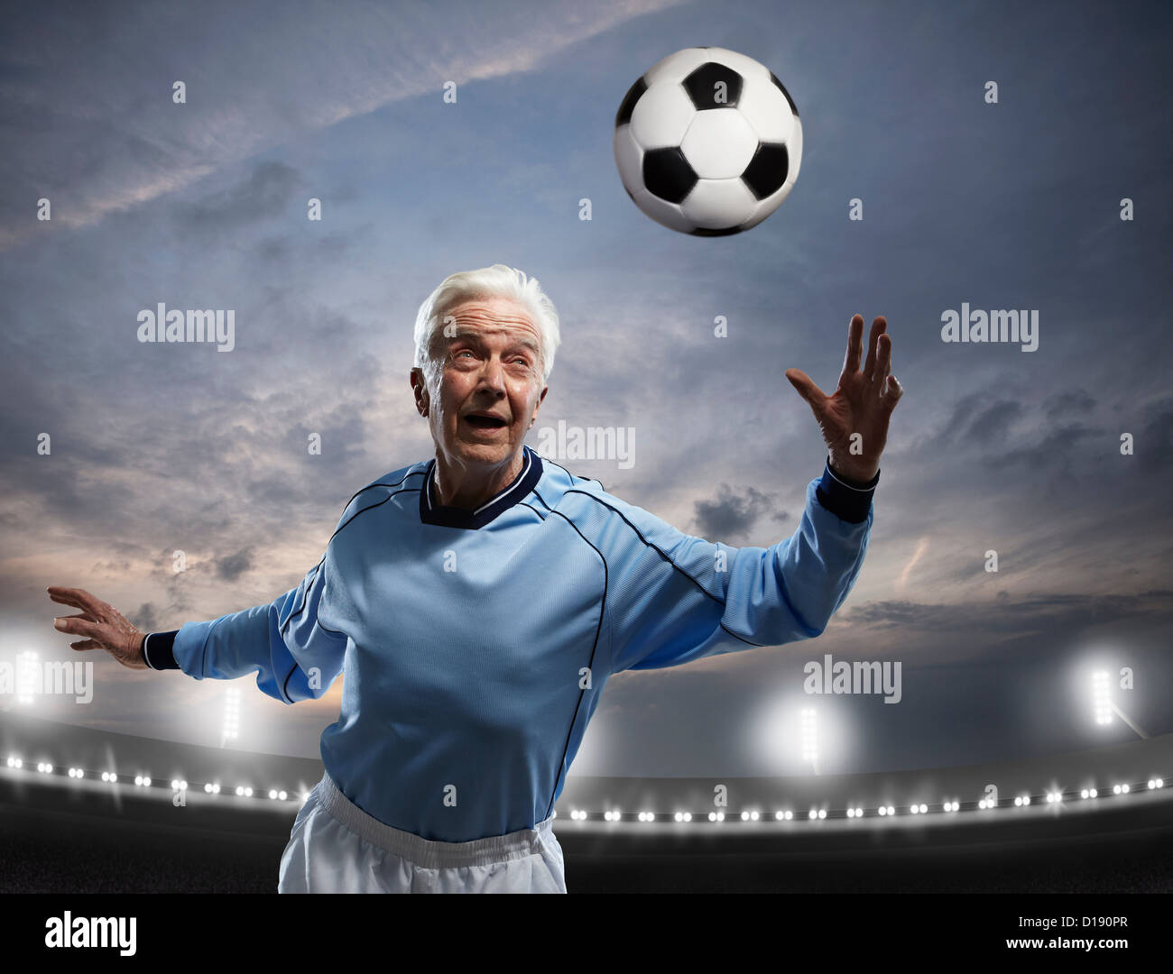 Senior man playing football Stock Photo - Alamy