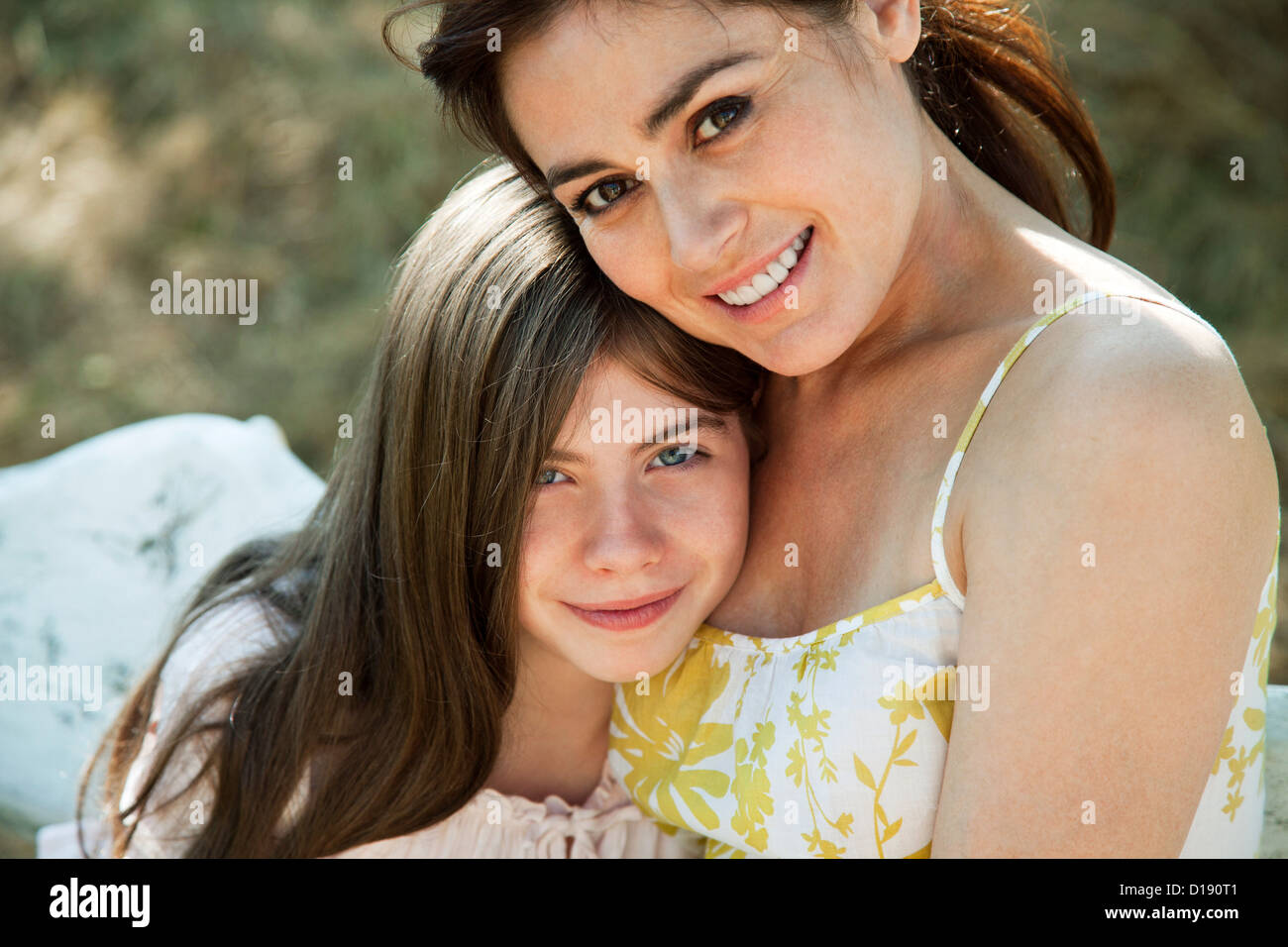 Portrait of mother and daughter hugging Stock Photo - Alamy