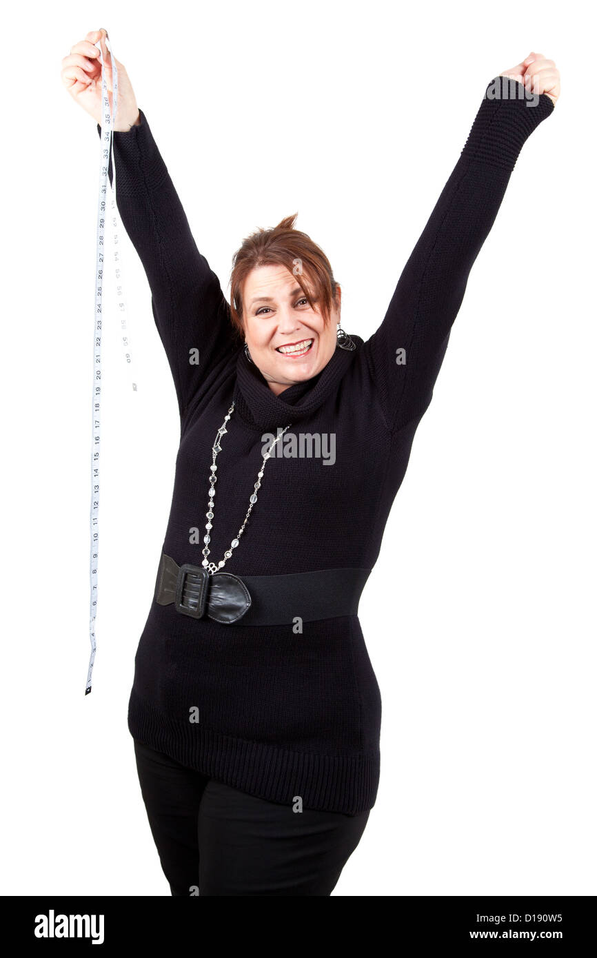 A jubilant woman raises her arms in triumph at achieving her goal Stock ...