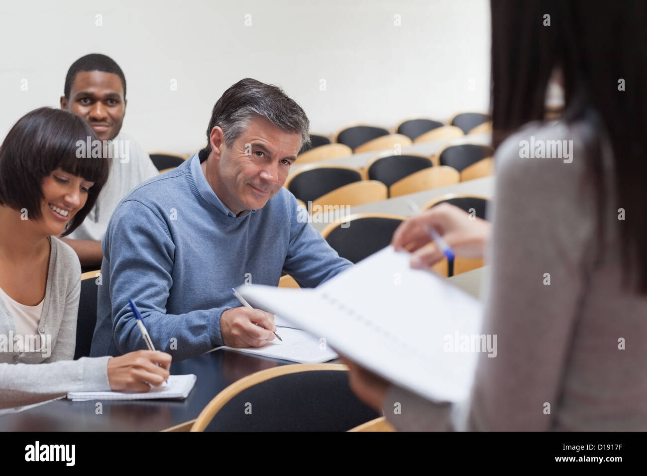 Students smiling in lecture Stock Photo - Alamy