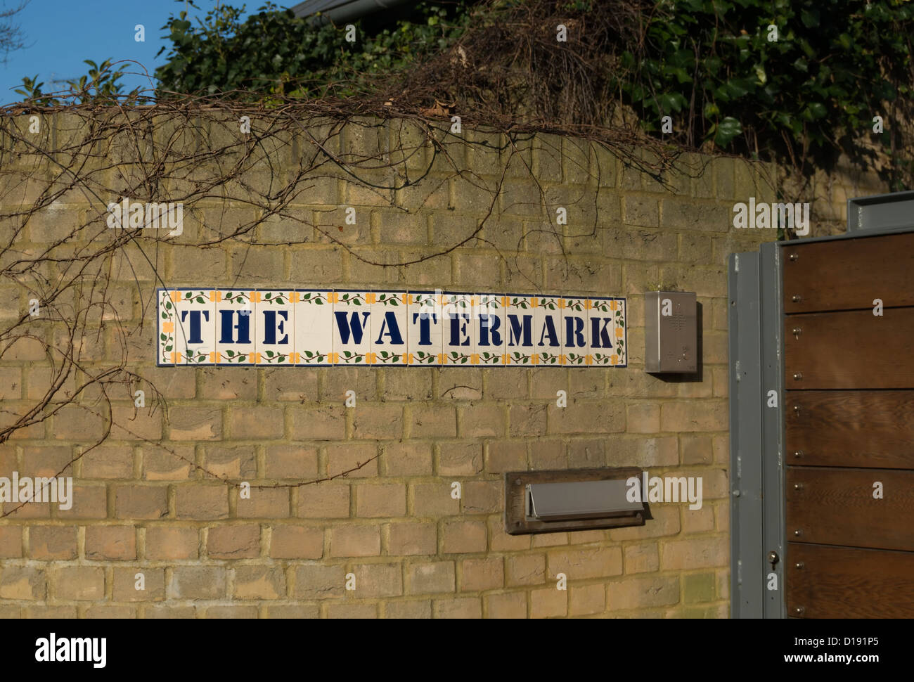 entrance with tiled name sign of the watermark, an architecturally ...