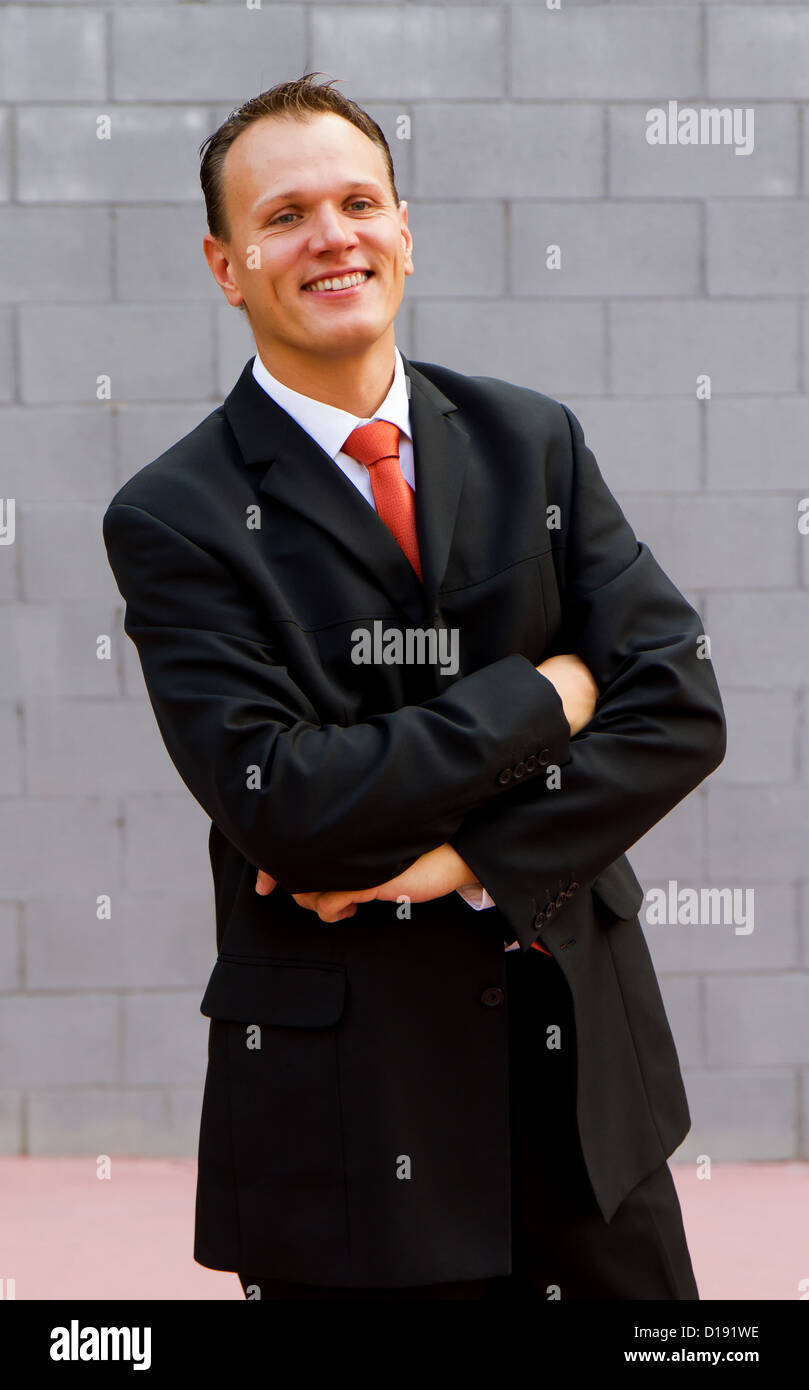 Happy smiling young businessman front the camera Stock Photo - Alamy