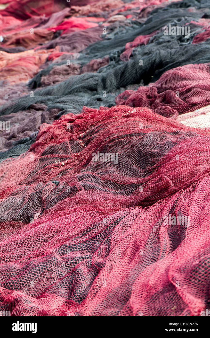 Red fishing nets drying on the port Stock Photo - Alamy
