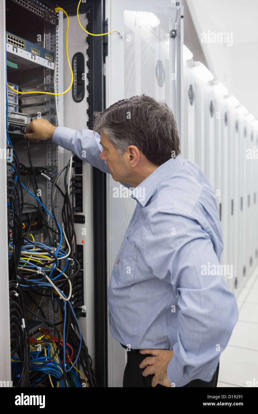 Technician working on a case of server racks Stock Photo - Alamy