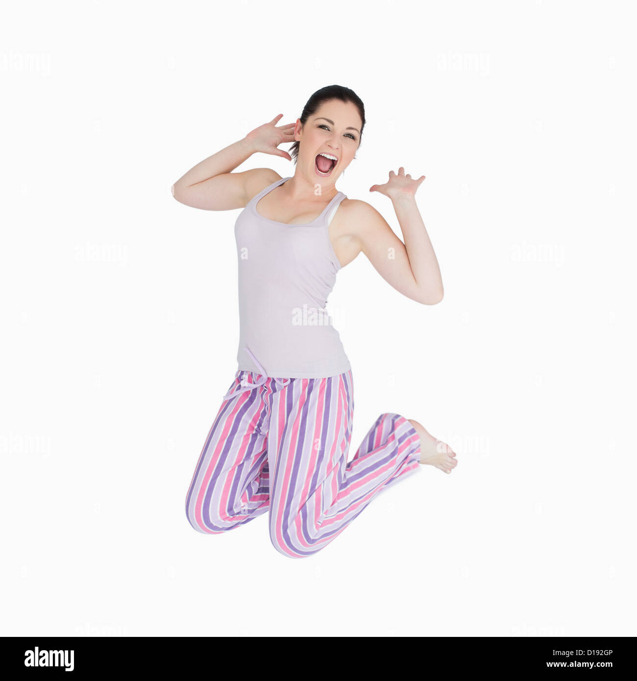 Yawning woman in pyjamas Stock Photo - Alamy