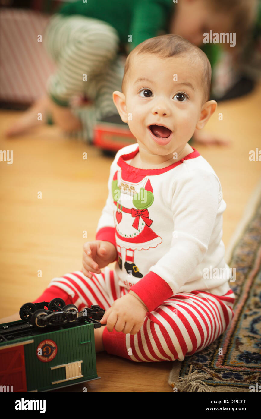Cute Infant Baby Enjoying Christmas Morning Near The Tree Stock Photo ...