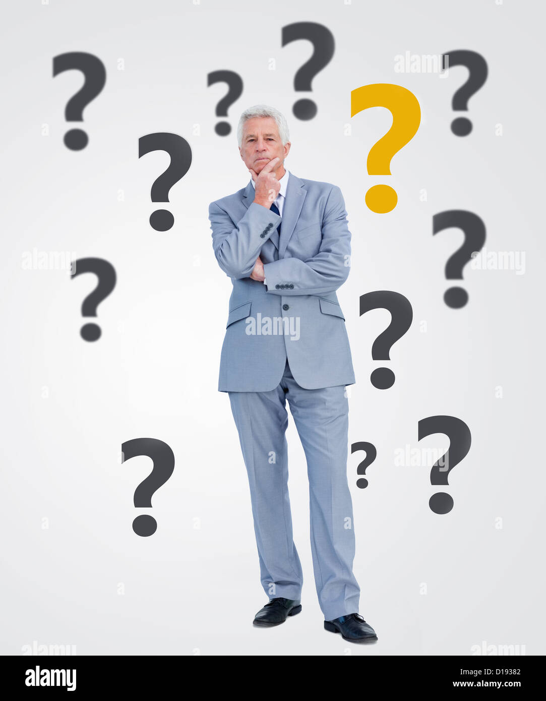 Mature businessman thinking Stock Photo - Alamy