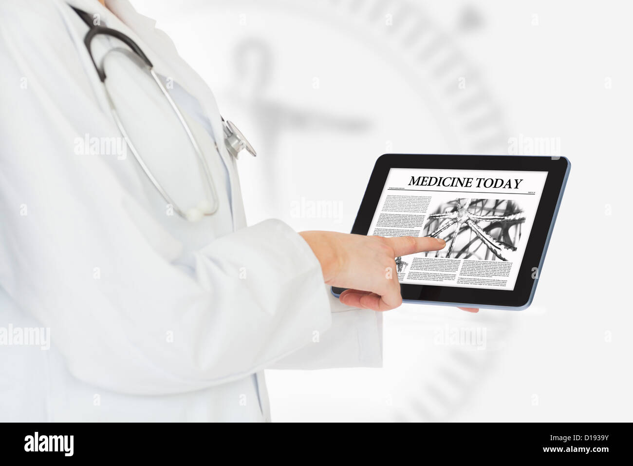 Doctor reading from digital tablet Stock Photo - Alamy