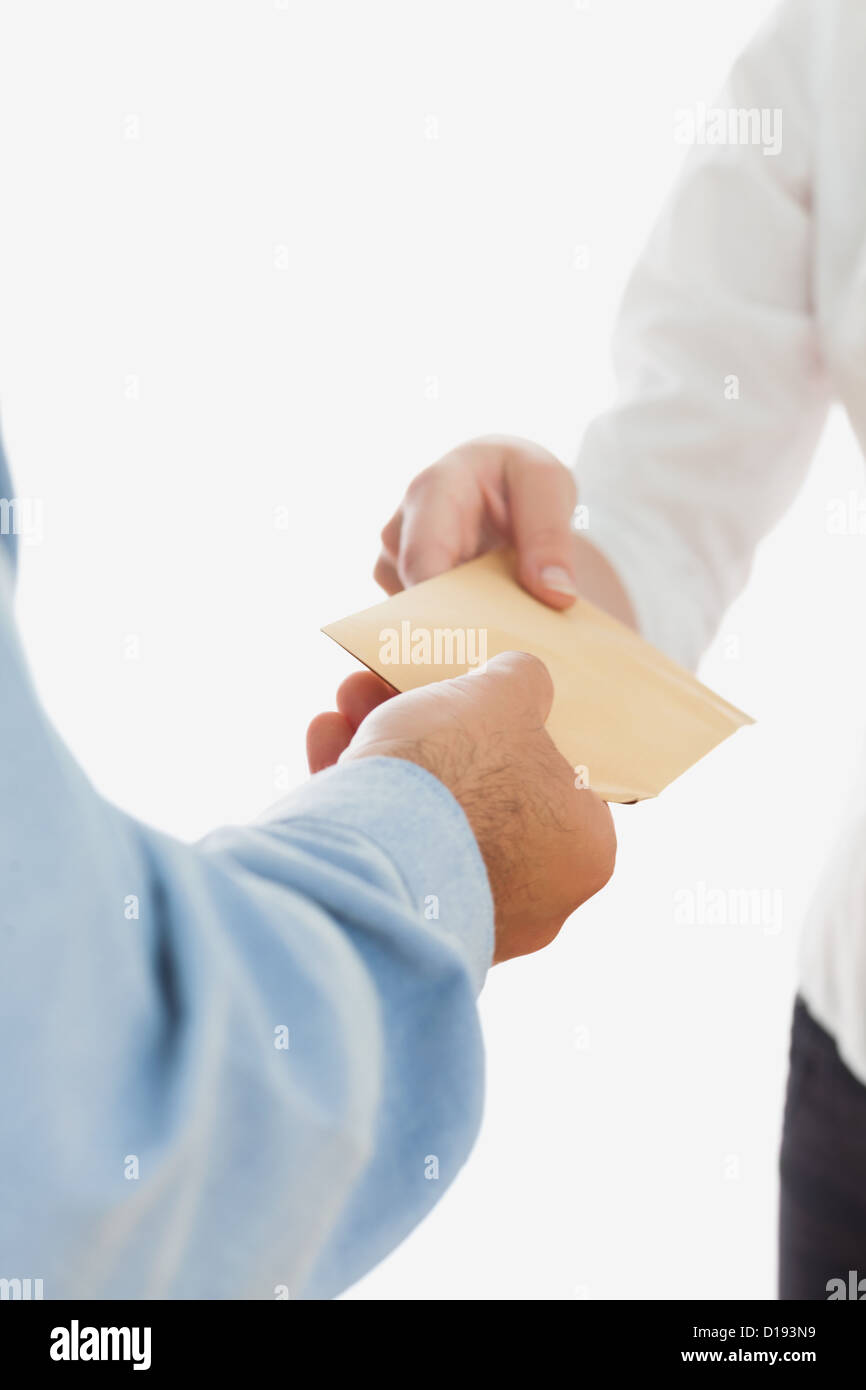 Man handing over white envelope hi-res stock photography and images - Alamy