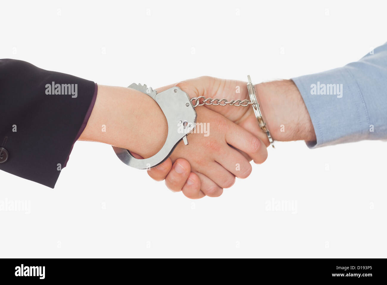 Business people in handcuffs shaking hands Stock Photo - Alamy