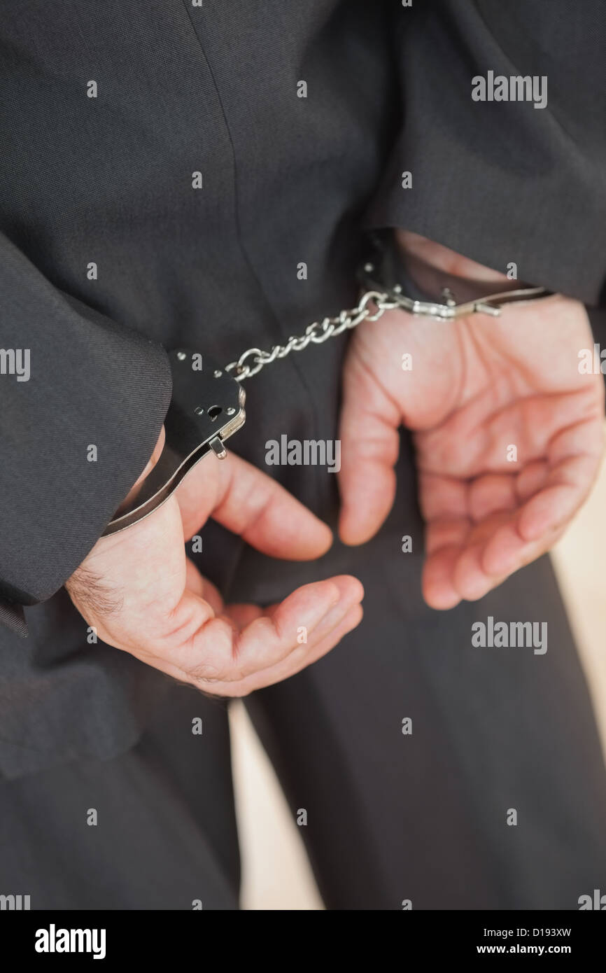 Hands with handcuffs Stock Photo - Alamy