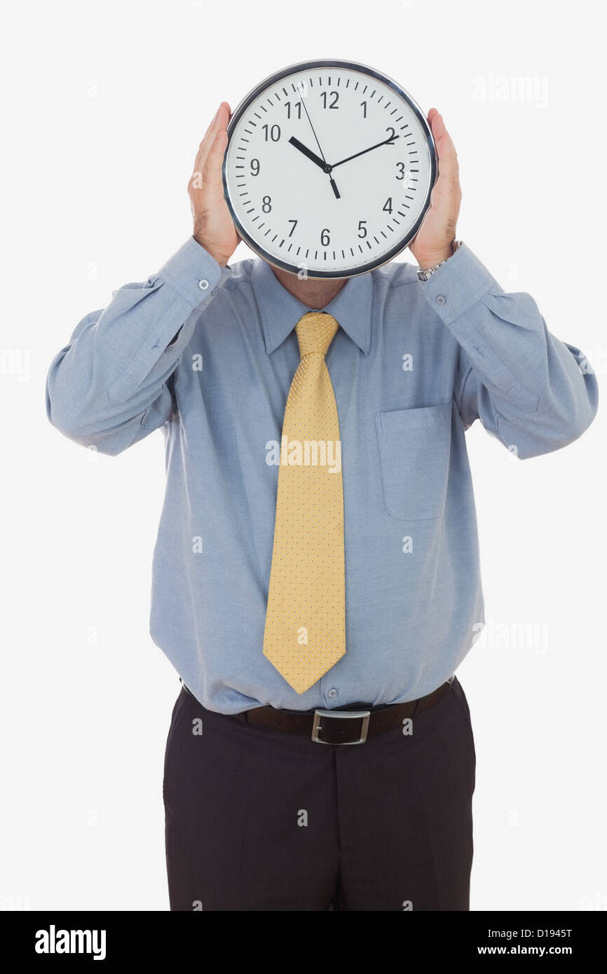 Businessman with clock face Stock Photo - Alamy