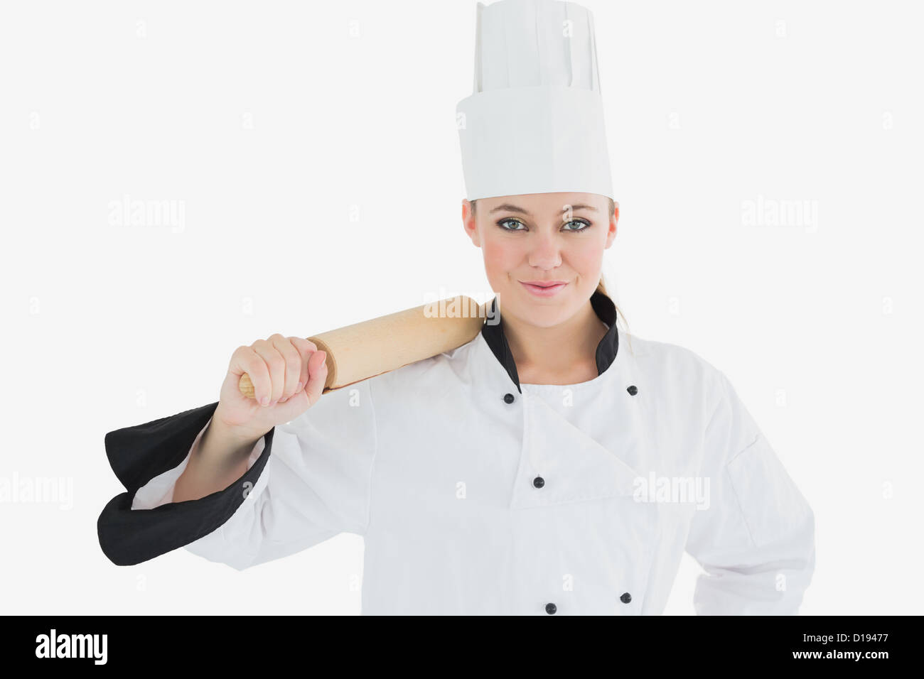 Female chef holding rolling pin Stock Photo - Alamy