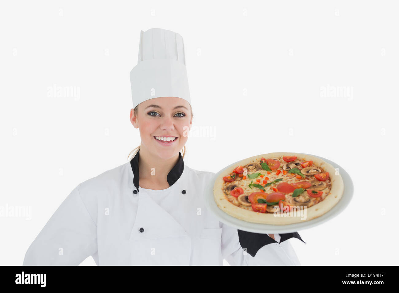 Happy female chef holding pizza Stock Photo - Alamy