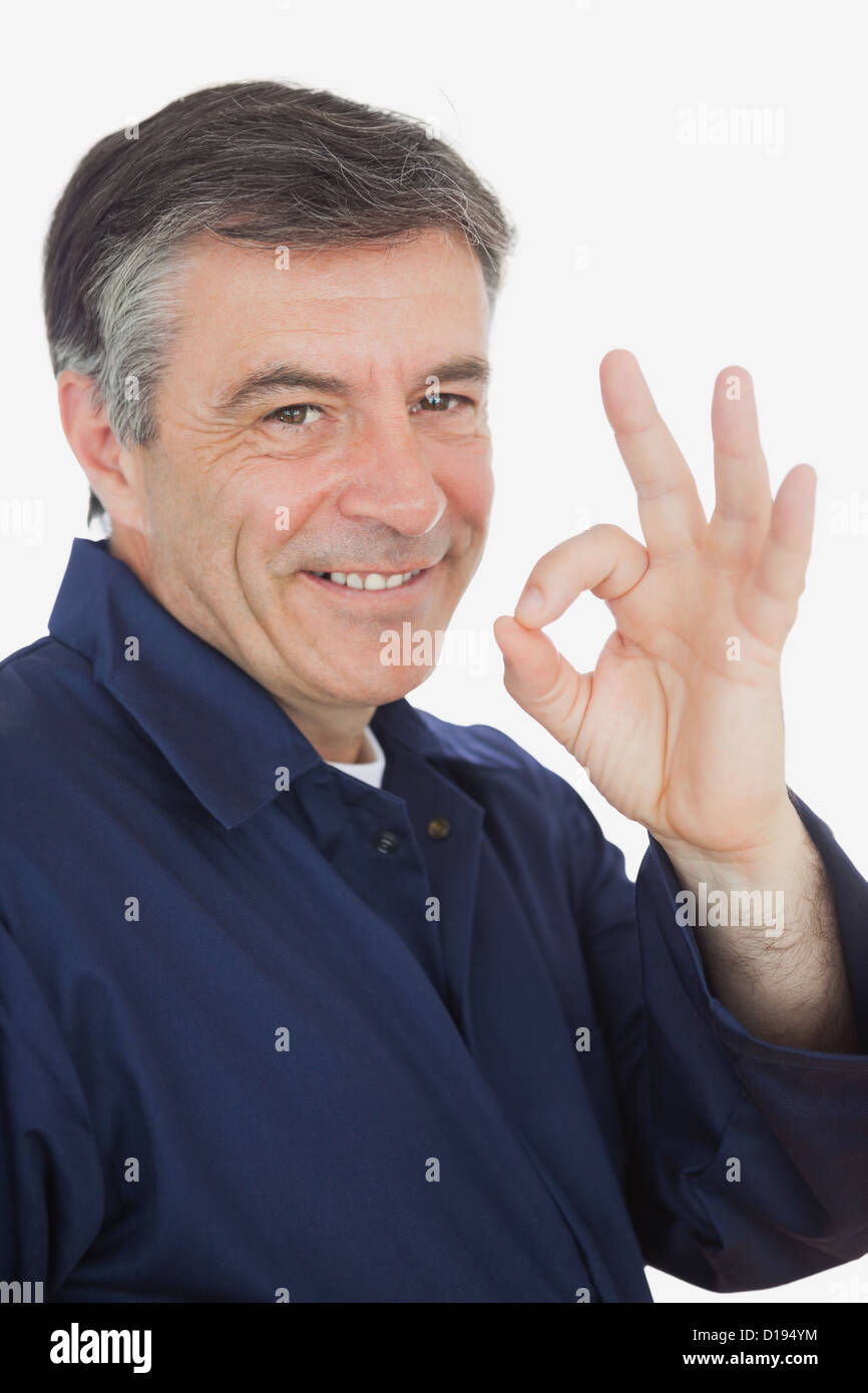 Mechanic showing ok sign Stock Photo - Alamy