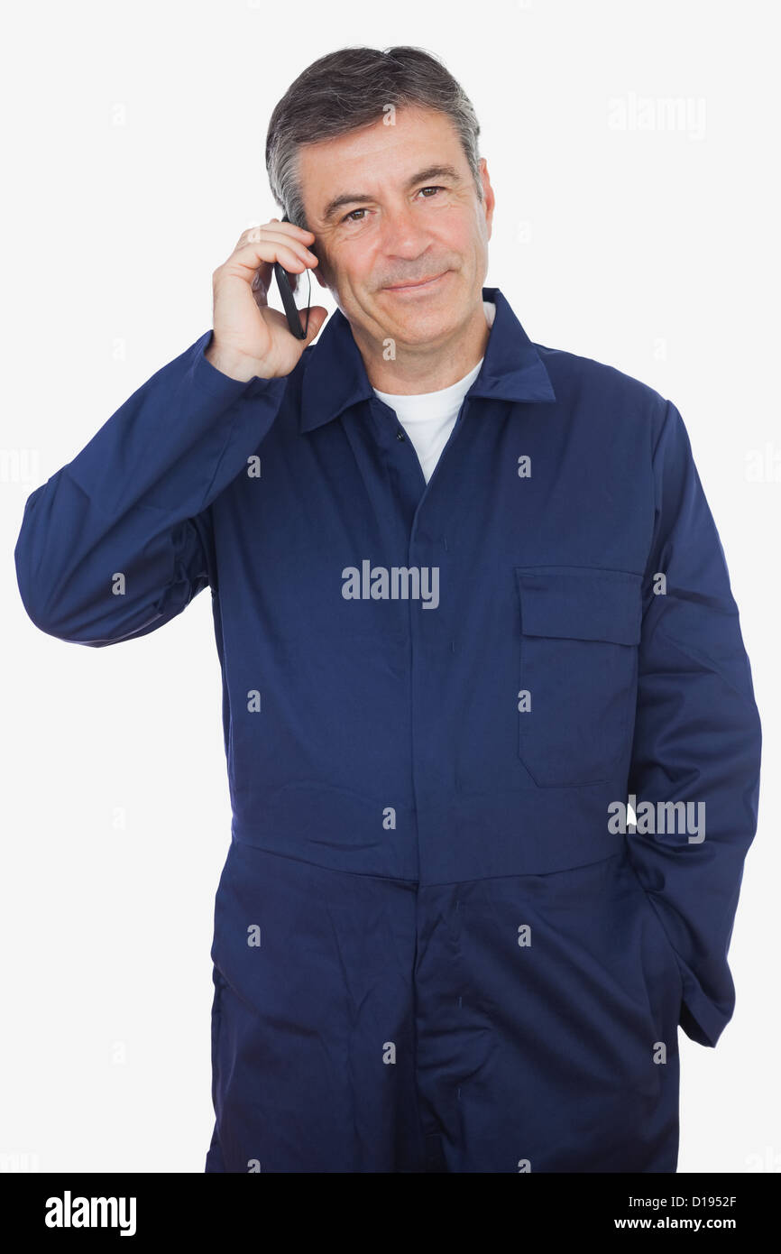 Mechanic using cell phone Stock Photo - Alamy