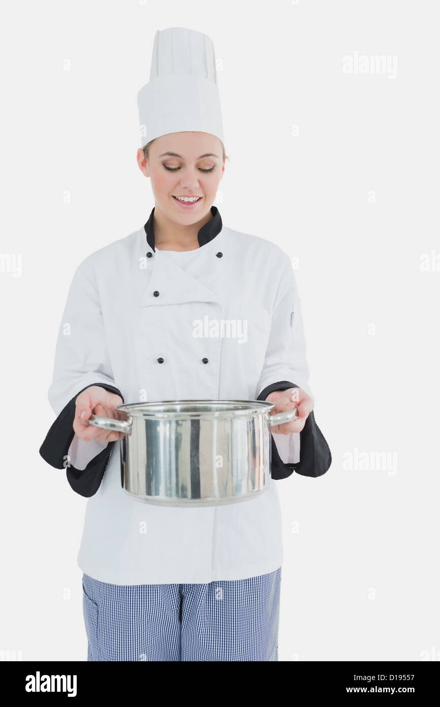 Happy chef holding utensil Stock Photo - Alamy