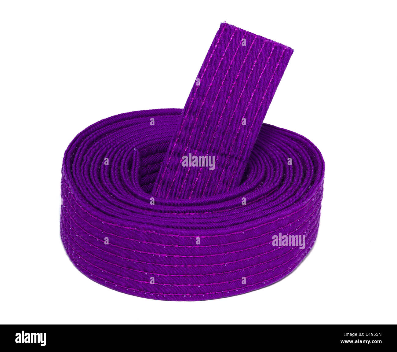 Coiled karate purple belt isolated on white background Stock Photo - Alamy