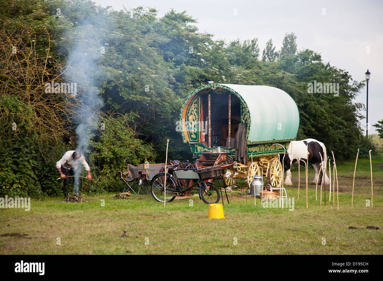 Romany gypsy makes camp in grassy clearing in Norfolk village Stock ...