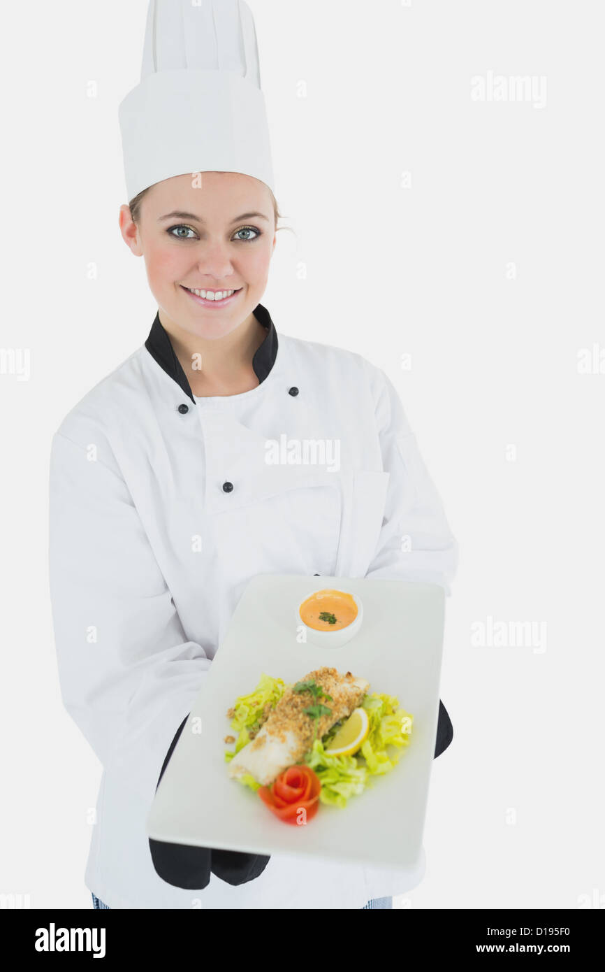 Female chef offering healthy food Stock Photo - Alamy