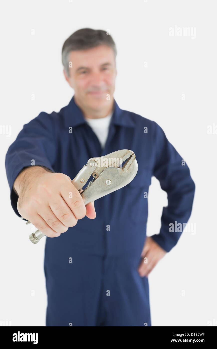 Male mechanic holding vise grip Stock Photo - Alamy