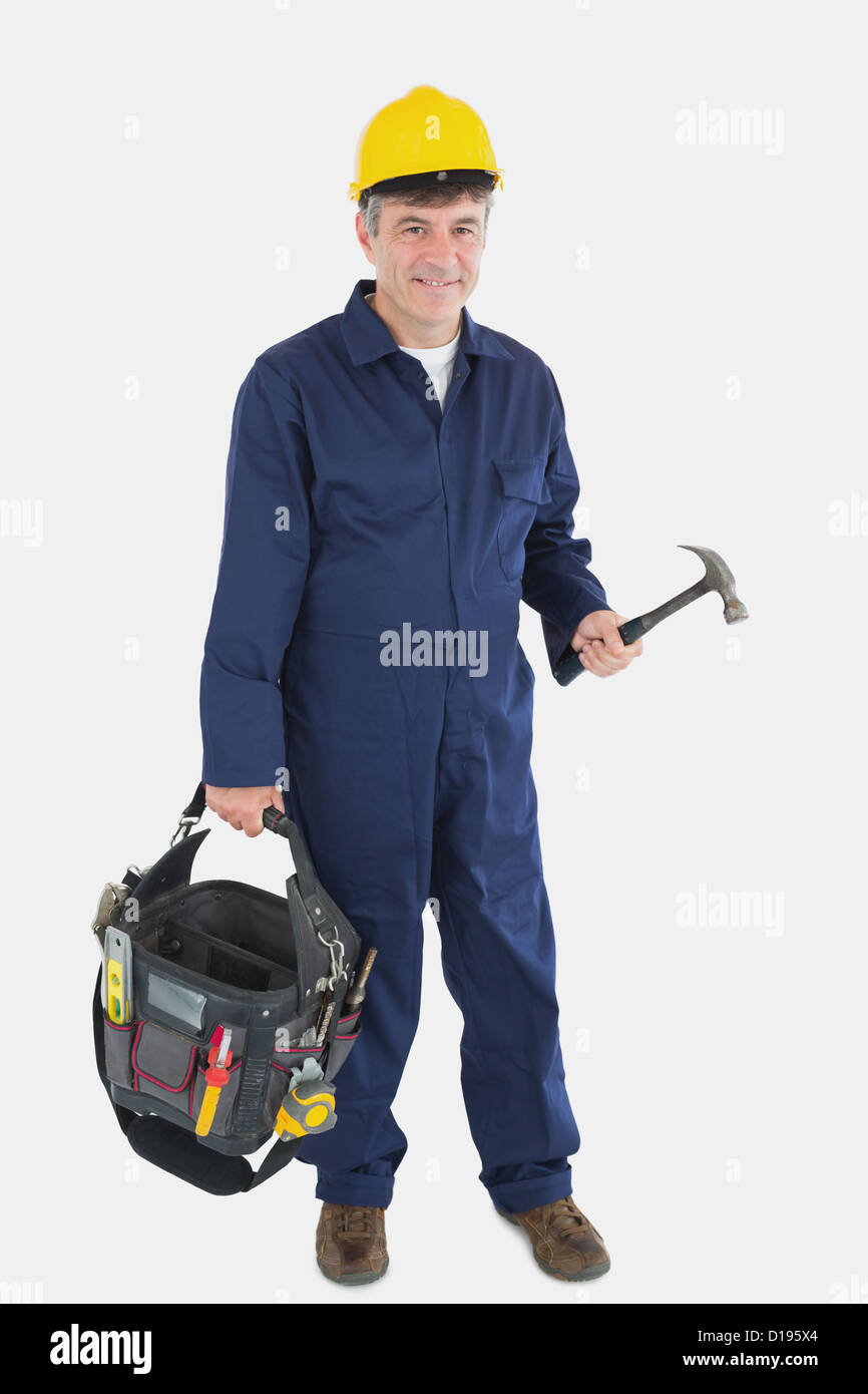 Technician wearing hardhat while carrying tool bag Stock Photo - Alamy