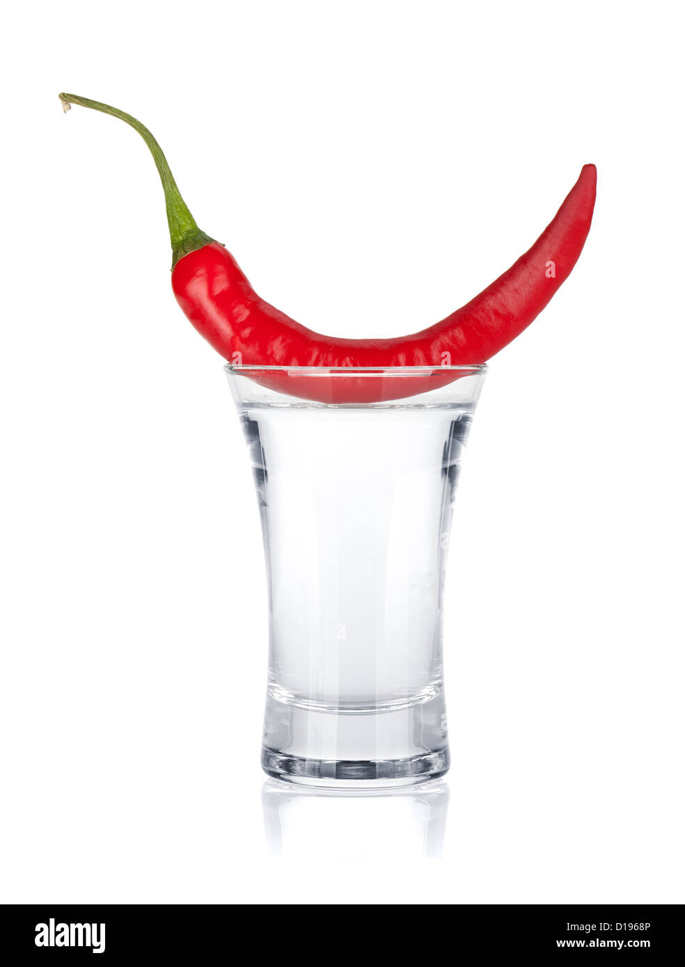 Shot of vodka and red hot chili pepper. Isolated on white background ...