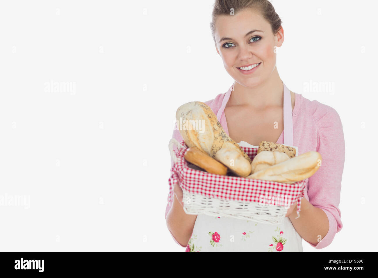 Beautiful woman holding bread basket Stock Photo - Alamy