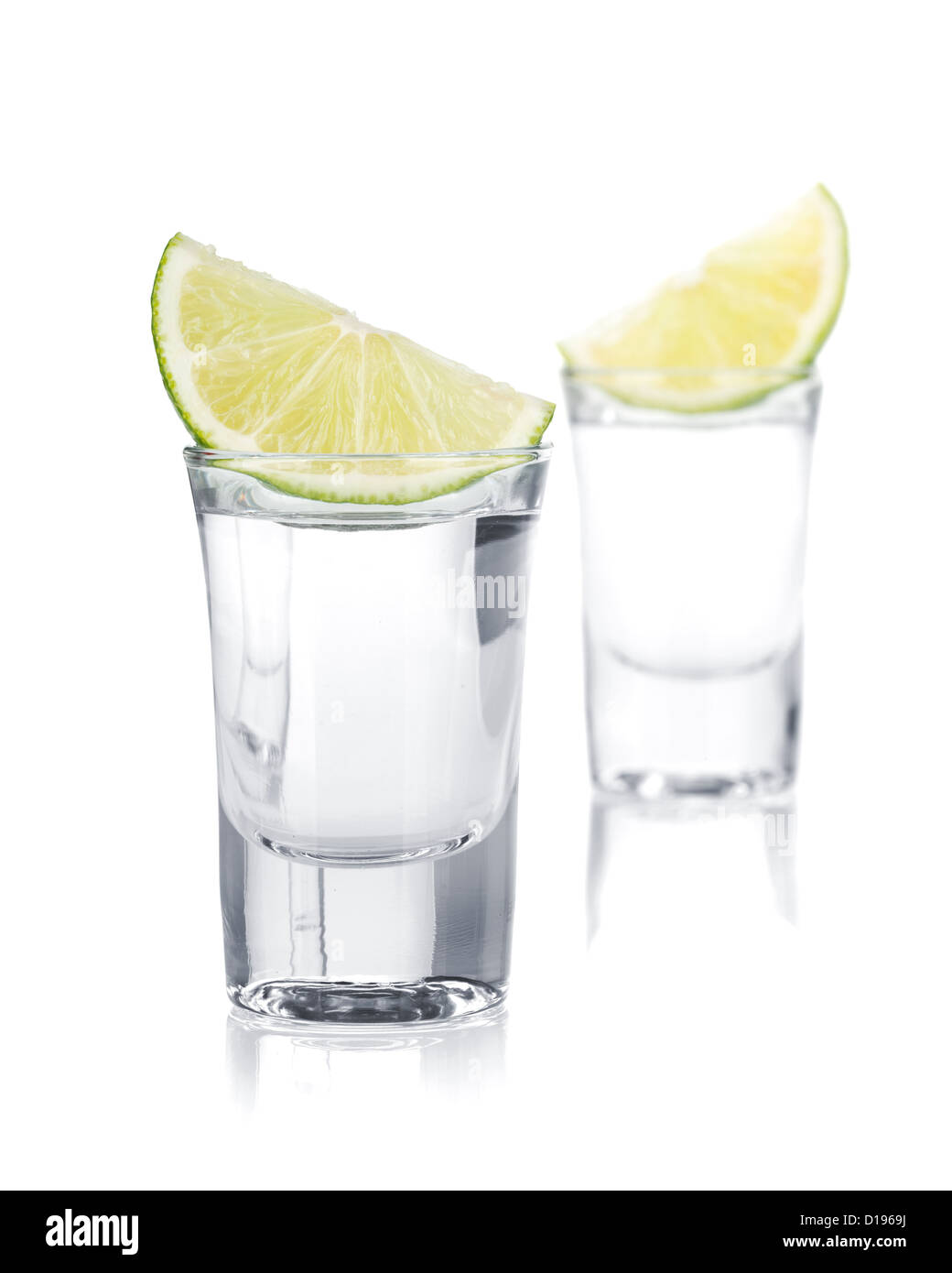 Two shots of vodka and lime slice. Isolated on white background Stock ...
