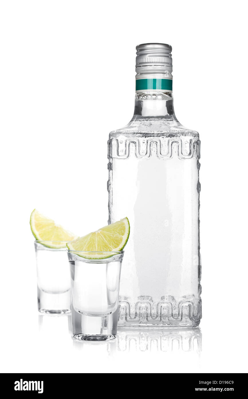 Bottle of silver tequila and two shots with lime slice. Isolated on ...
