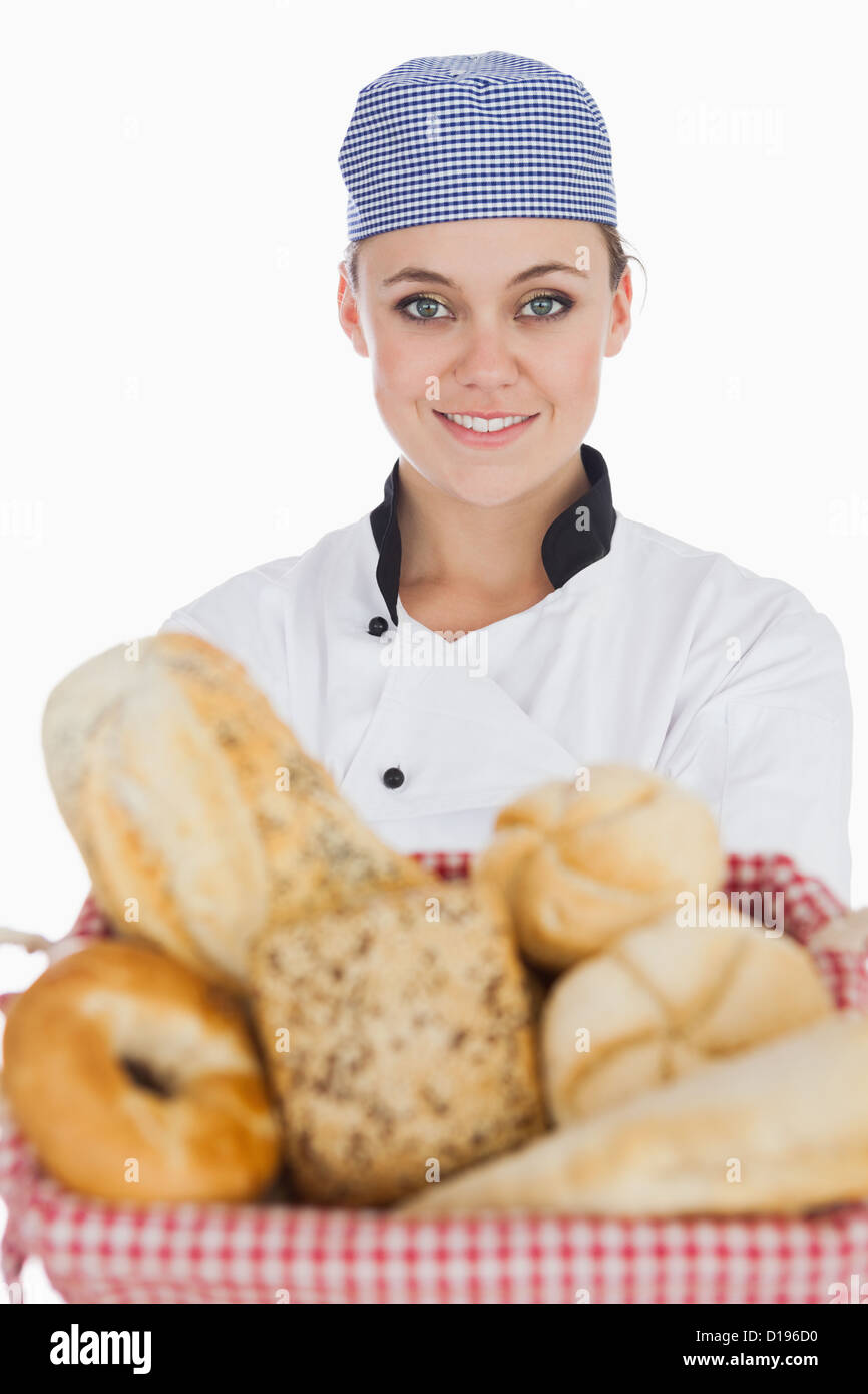 Female chef with variety of breads Stock Photo - Alamy