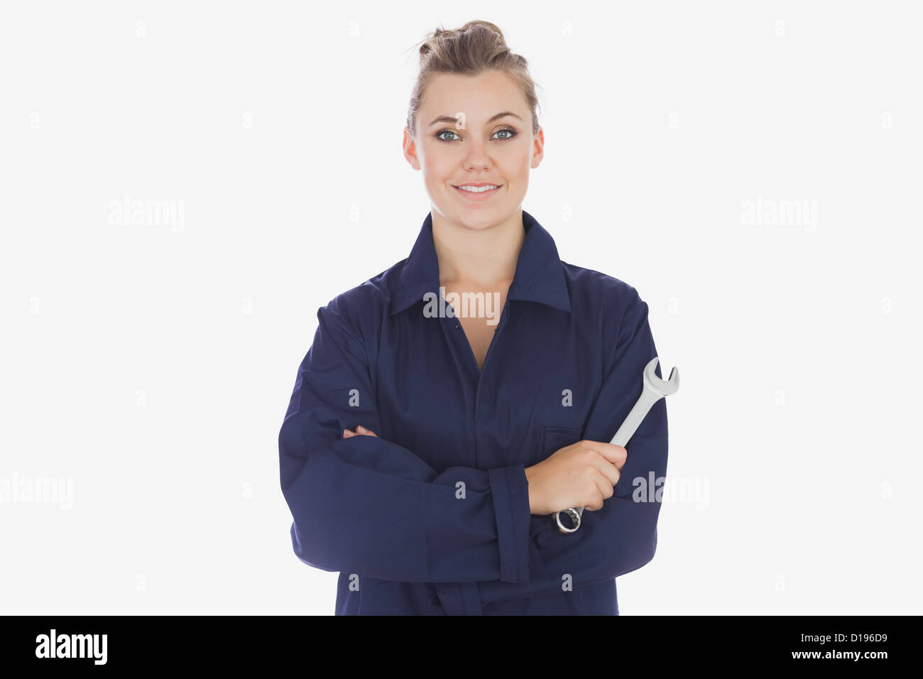 Female mechanic holding spanner Stock Photo - Alamy