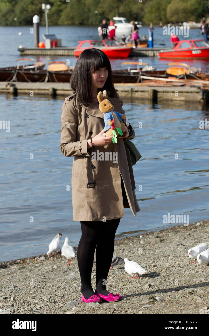 Japanese girl woman tourist posing for photograph with Peter Rabbit day ...