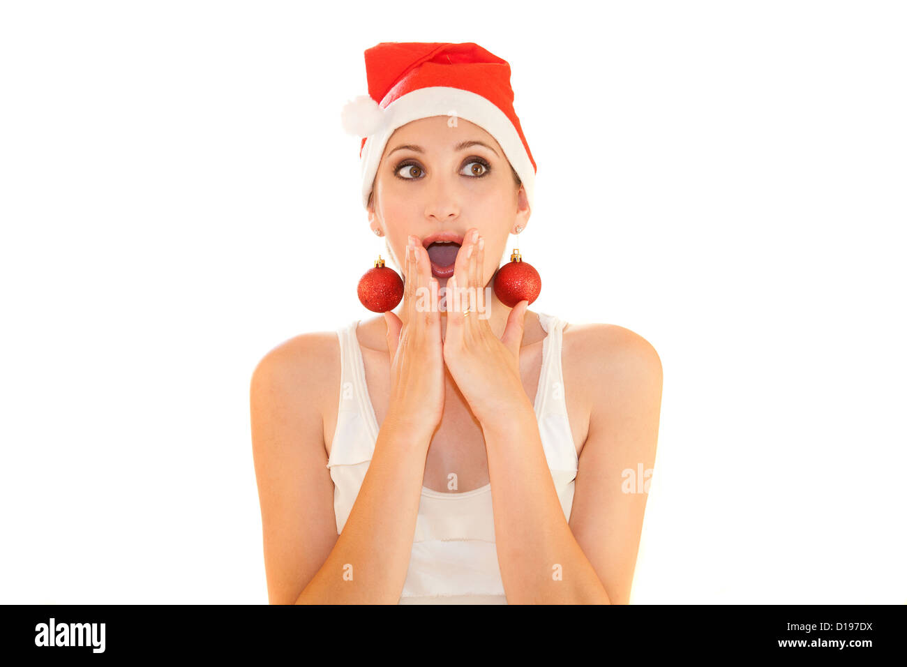 Surprised woman wearing Christmas hat Stock Photo - Alamy