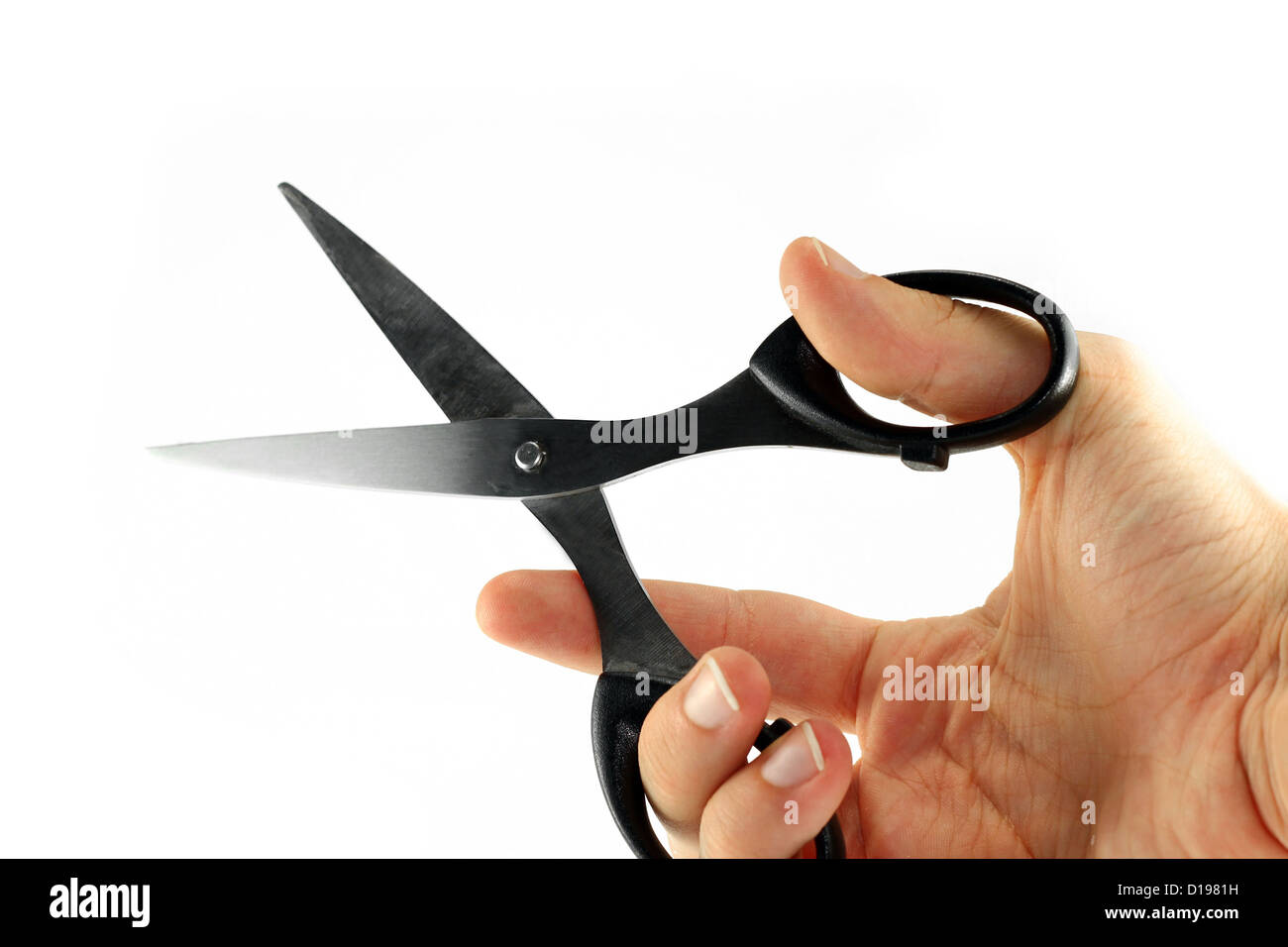 Hand holding opened scissors Stock Photo - Alamy
