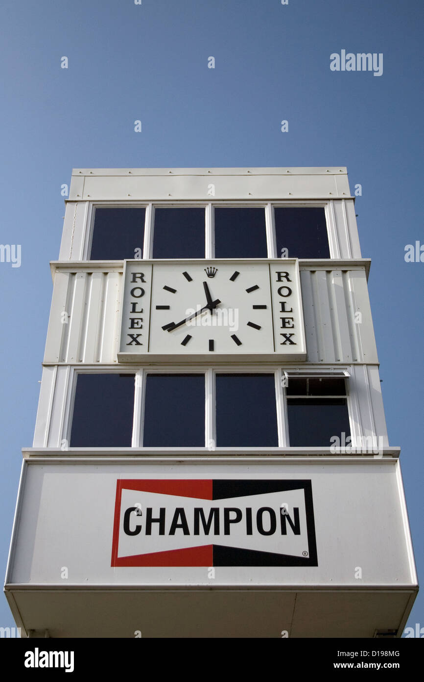A Champion sponsored Rolex clock tower at a motor racing circuit Stock ...