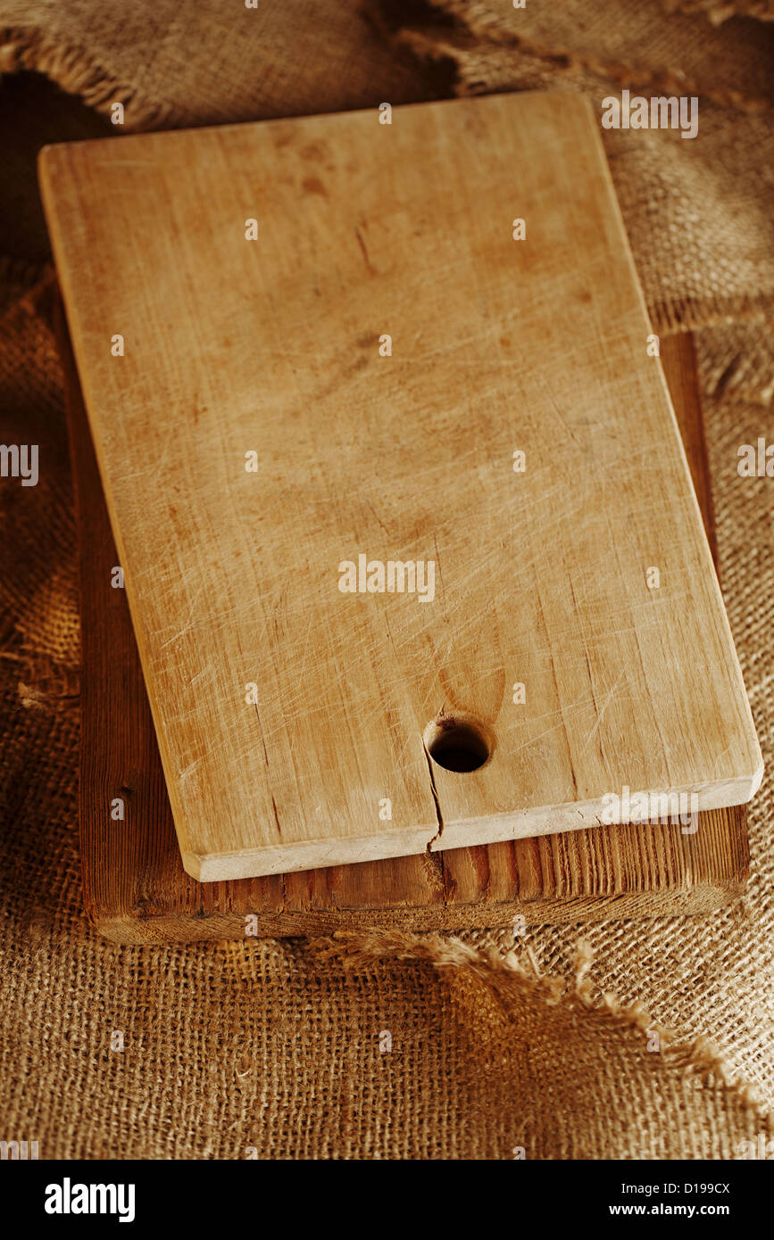 old woden choppig board on hessian backdrop, shallow dof Stock Photo ...