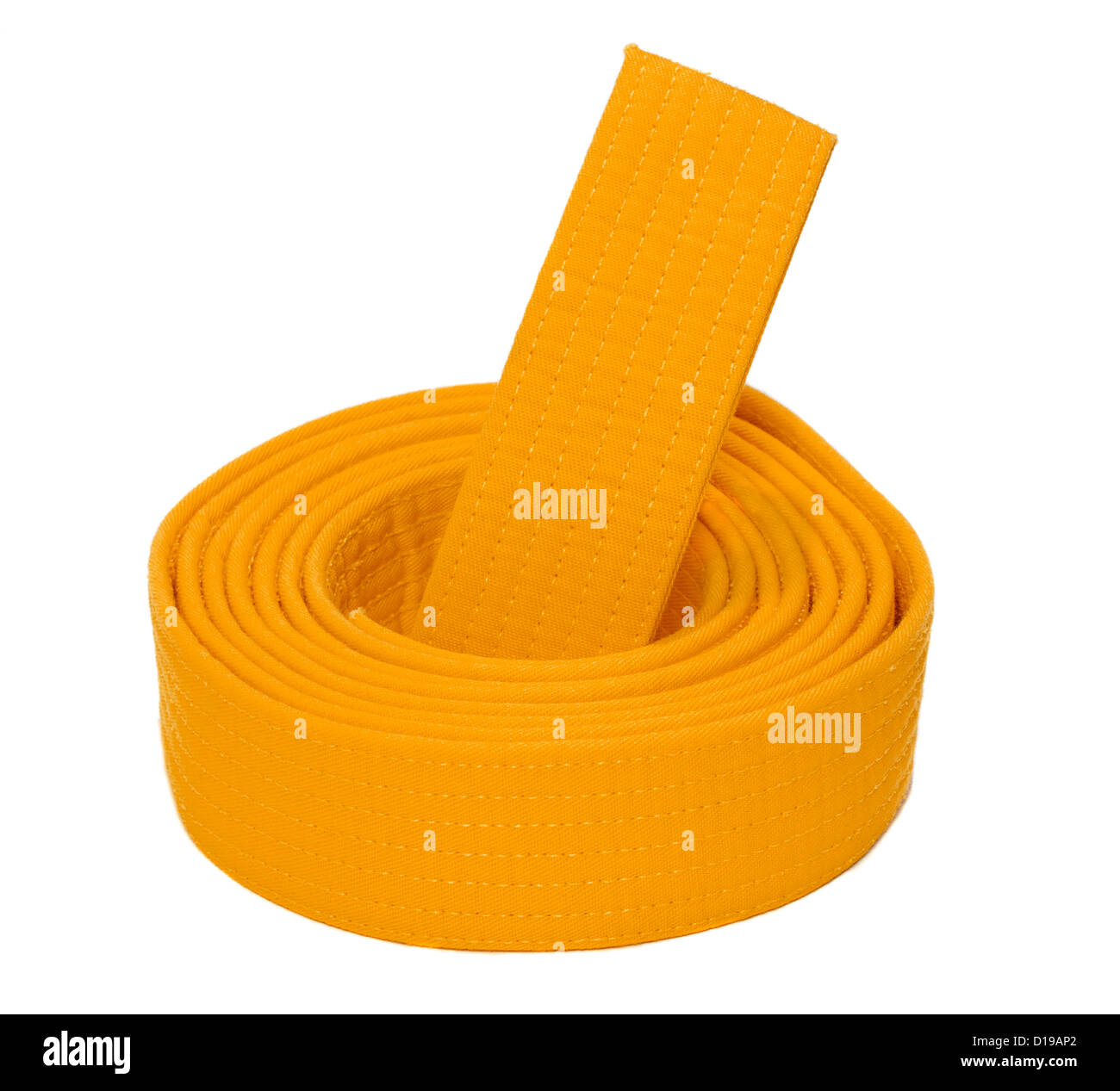 Coiled karate orange belt isolated on white background Stock Photo - Alamy