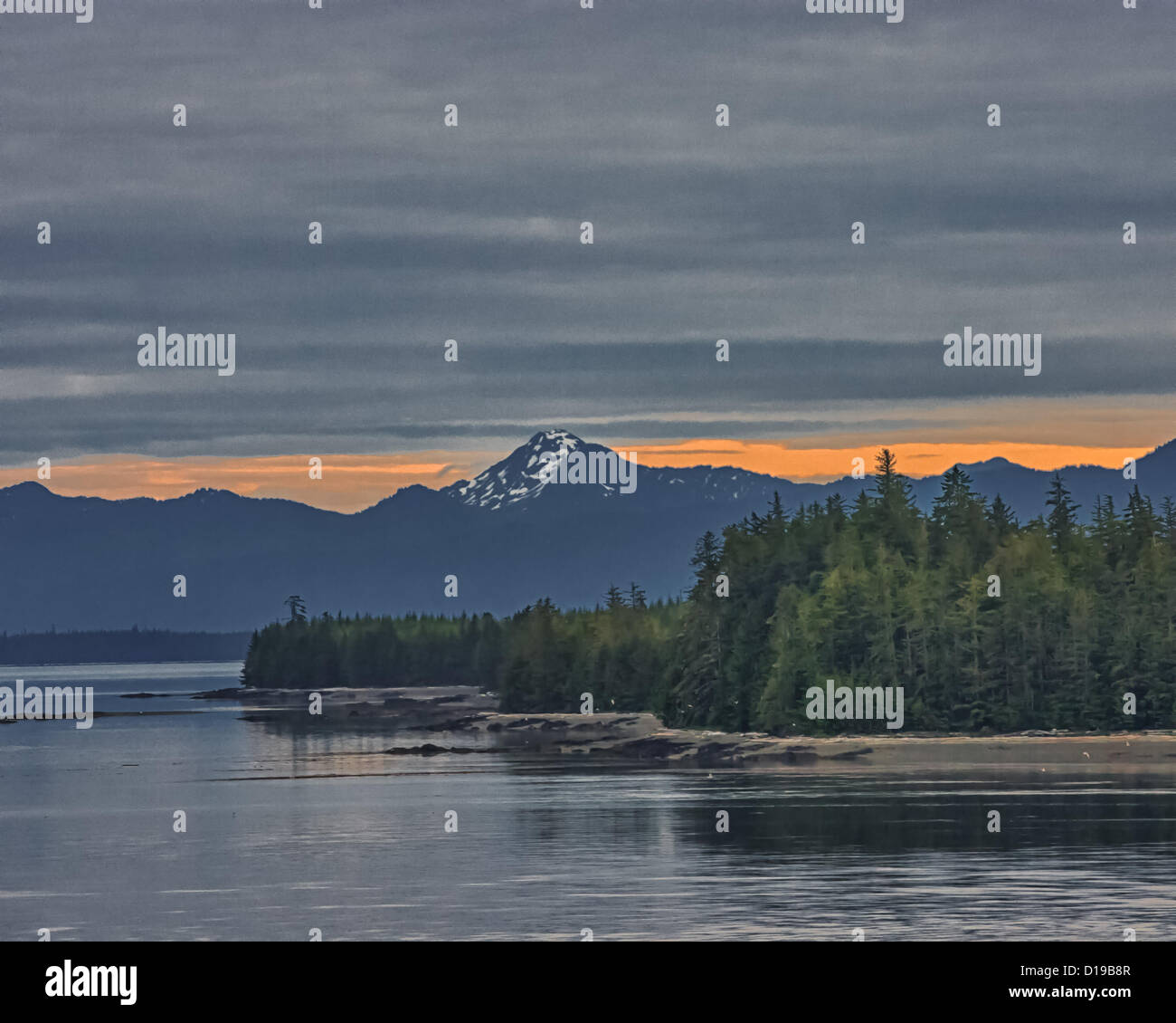 July 6, 2012 - Inside Passage, Alaska, US - The glow of early morning ...
