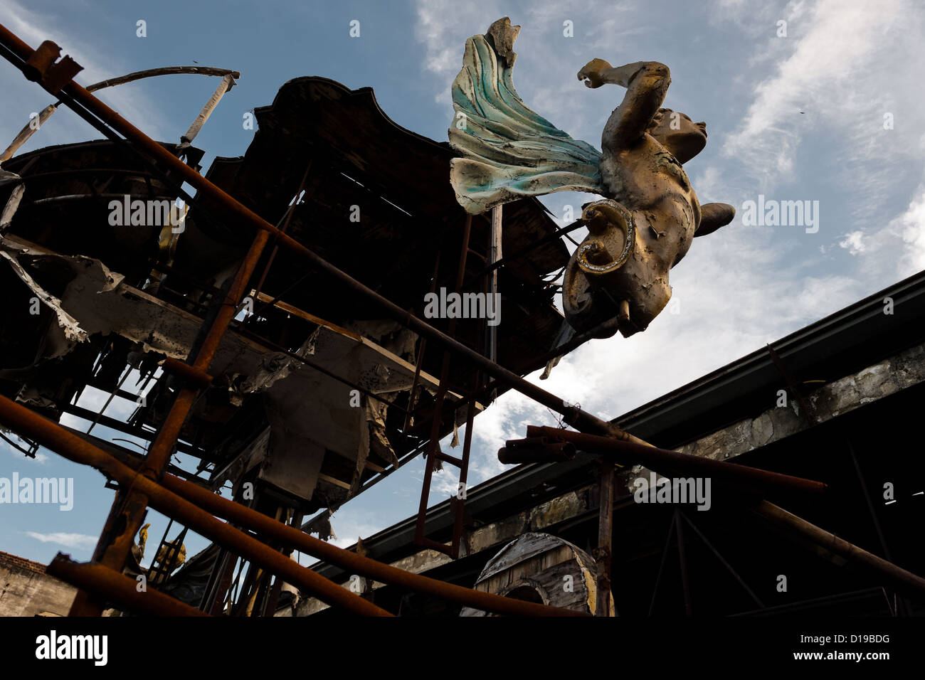 A dismantled and damaged carnival float abandoned on the work yard ...