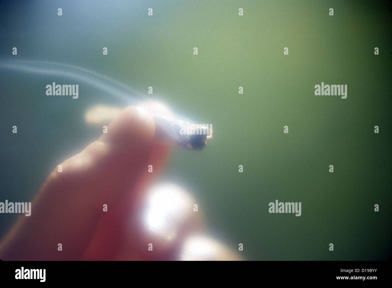 Cannabis joint holding lit hi-res stock photography and images - Alamy