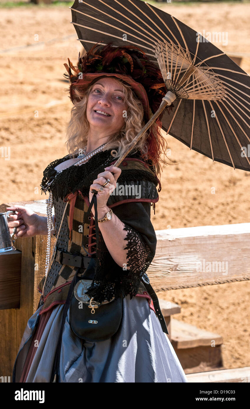 A lady in costume with umbrella at The Maryland Renaissance Festival ...
