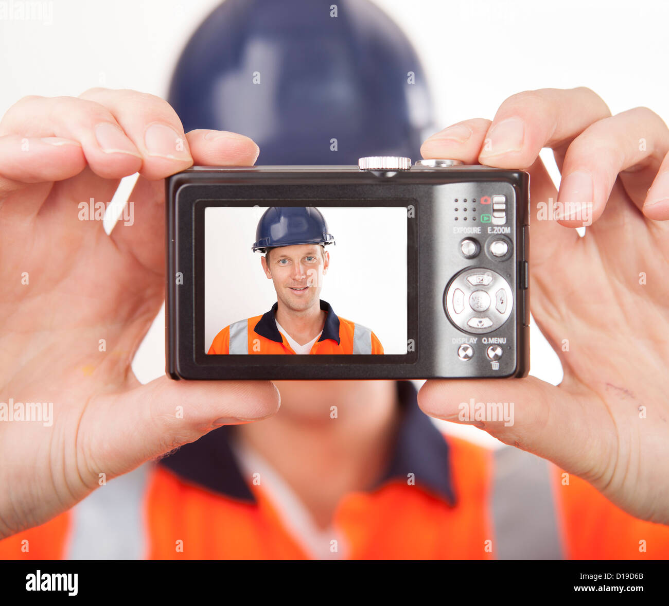 Carpenter taking self portrait with digital camera Stock Photo - Alamy