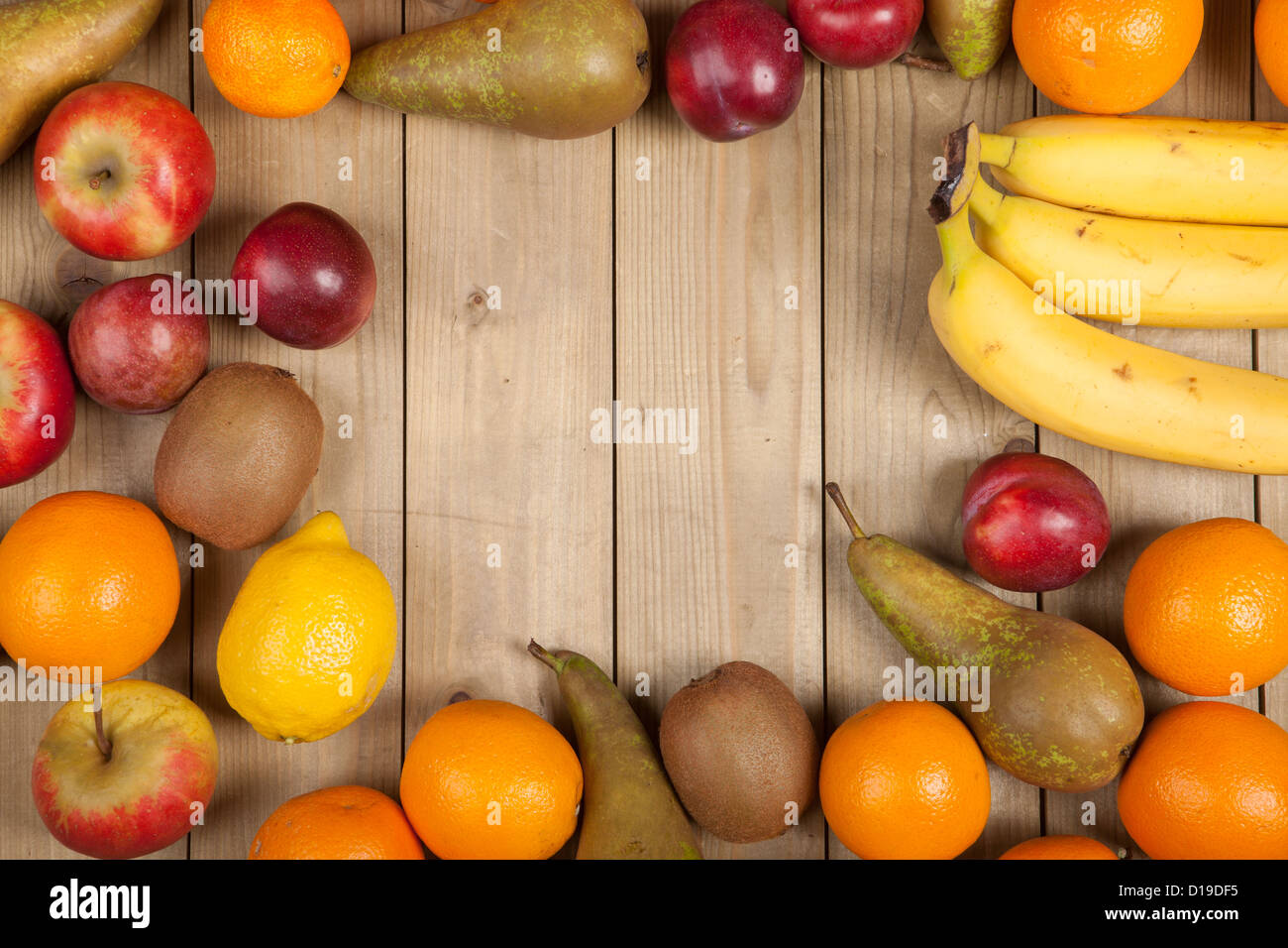 Fruits on wooden plank Stock Photo - Alamy