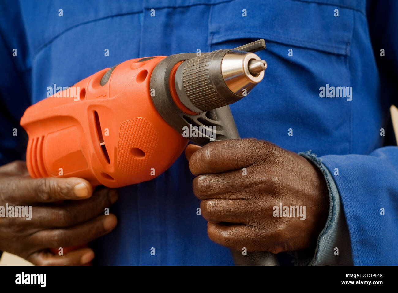 African American Construction Worker Holding Power Tool in Hands Stock ...