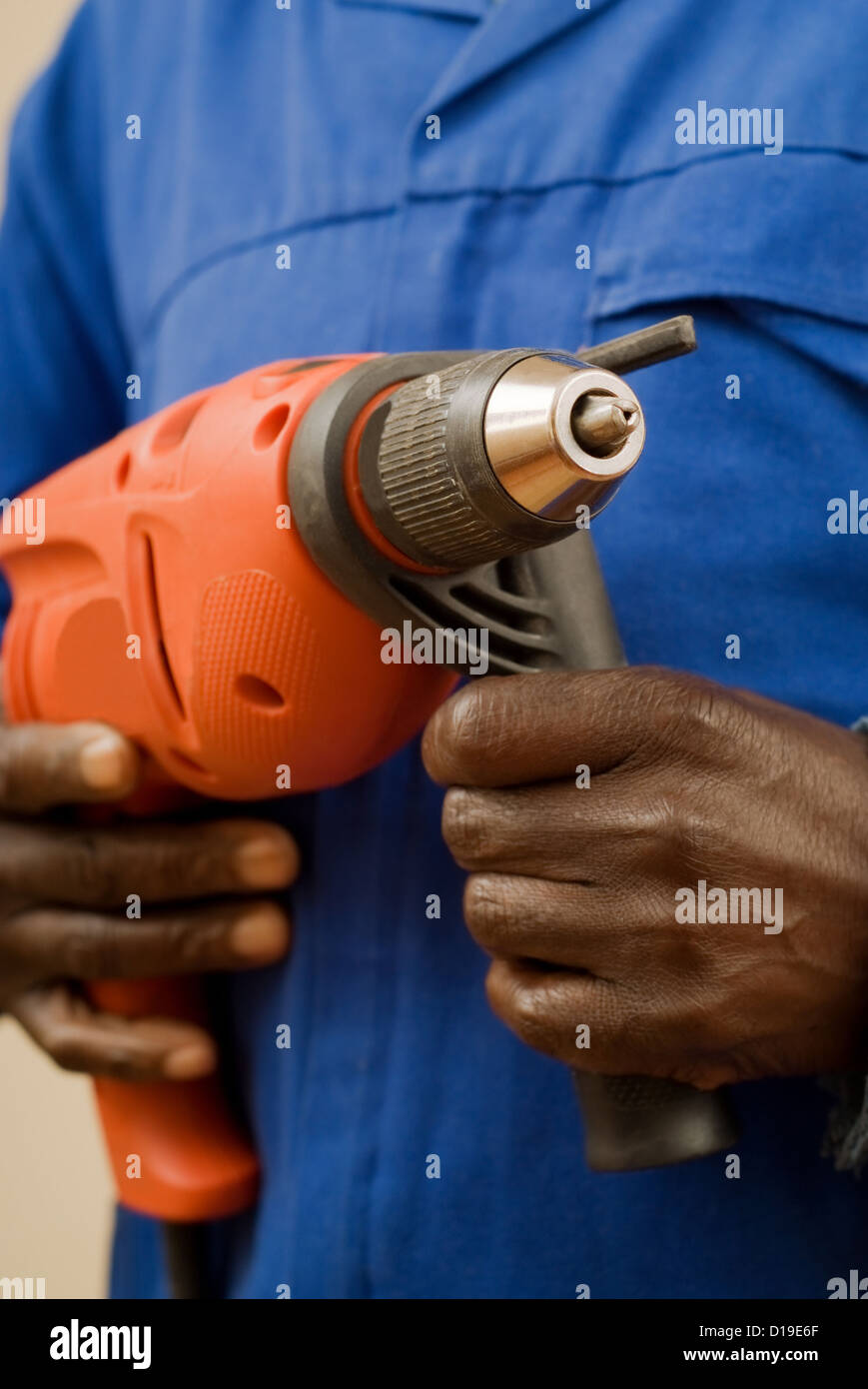 African American Construction Worker Holding Power Tool in Hands Stock ...