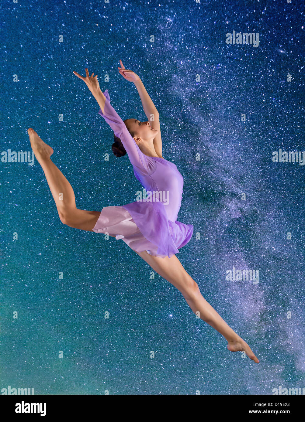 Ballerina leaping against starry night sky Stock Photo - Alamy
