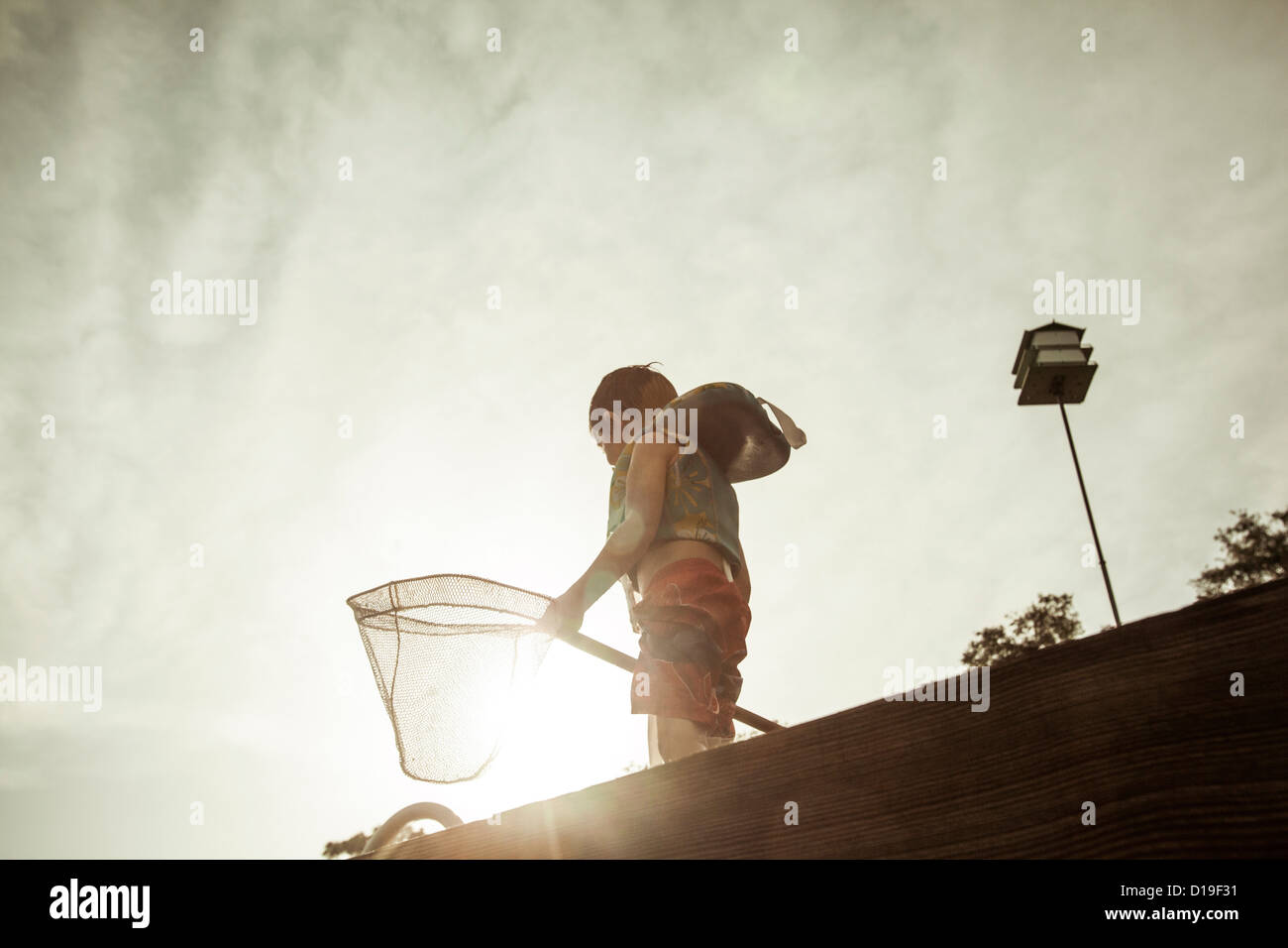Boy with fishing net Stock Photo - Alamy