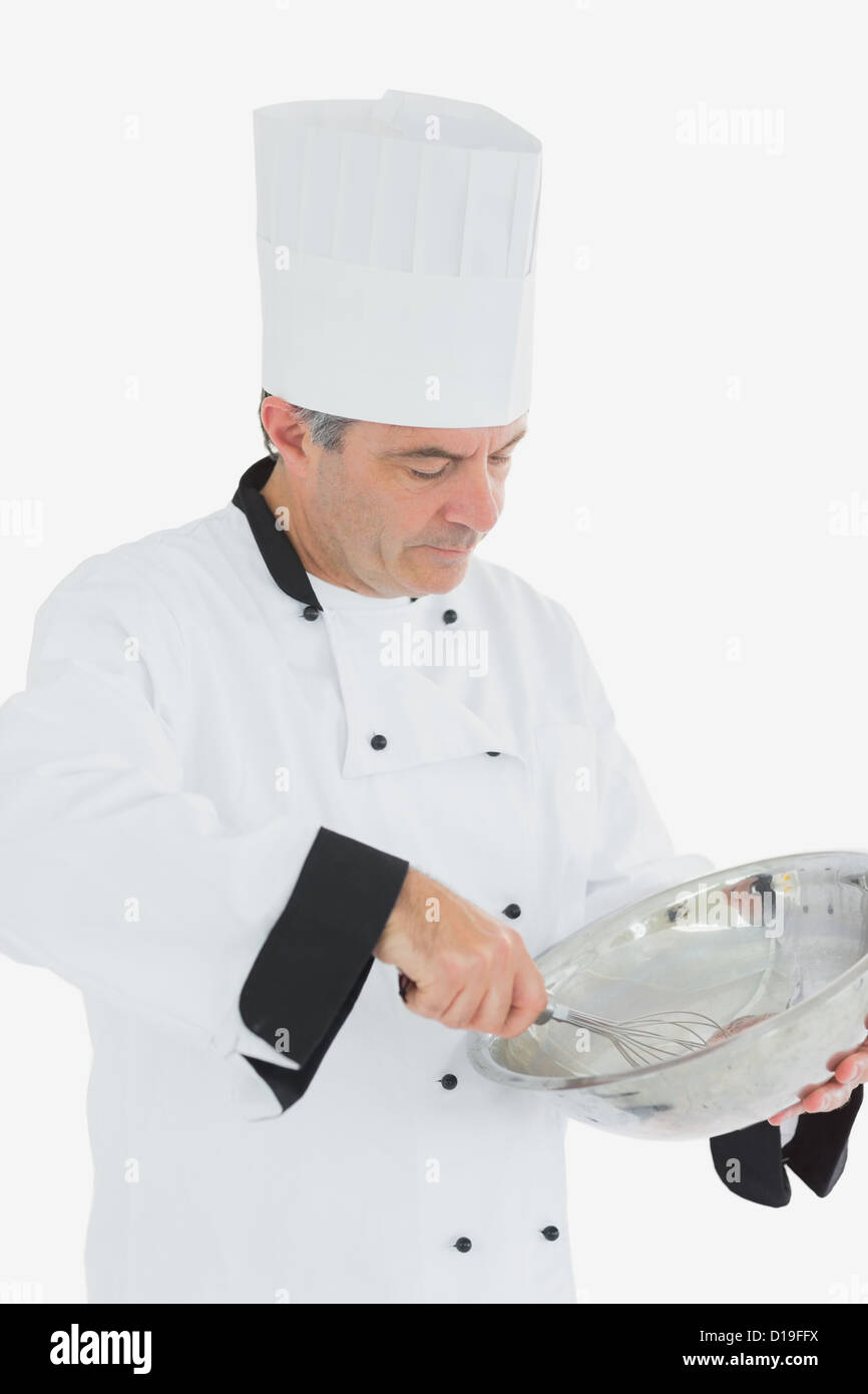 Chef using whisk and mixing bowl Stock Photo - Alamy